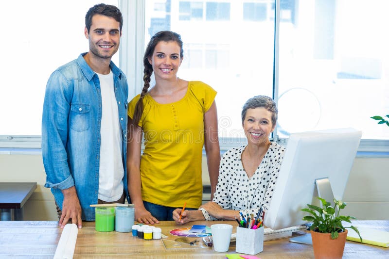 Casual Business Team Smiling at Camera during Meeting Stock Photo ...