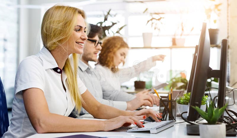 Casual Business Team Working on Computers in Office Stock Image - Image ...