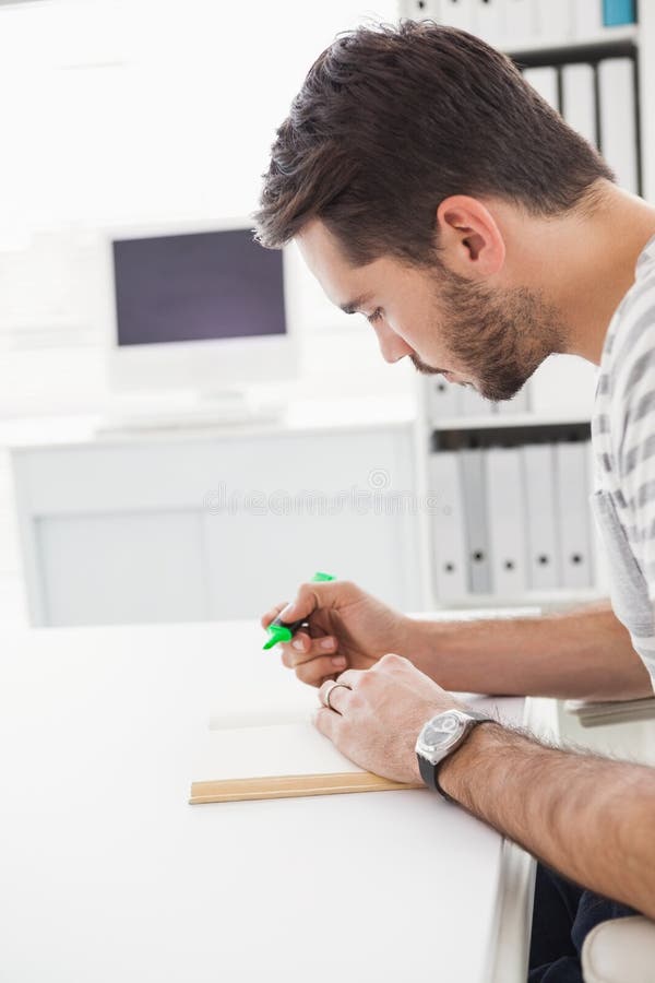 Businessman Highlighting Figures with Highlighter Stock Photo - Image ...