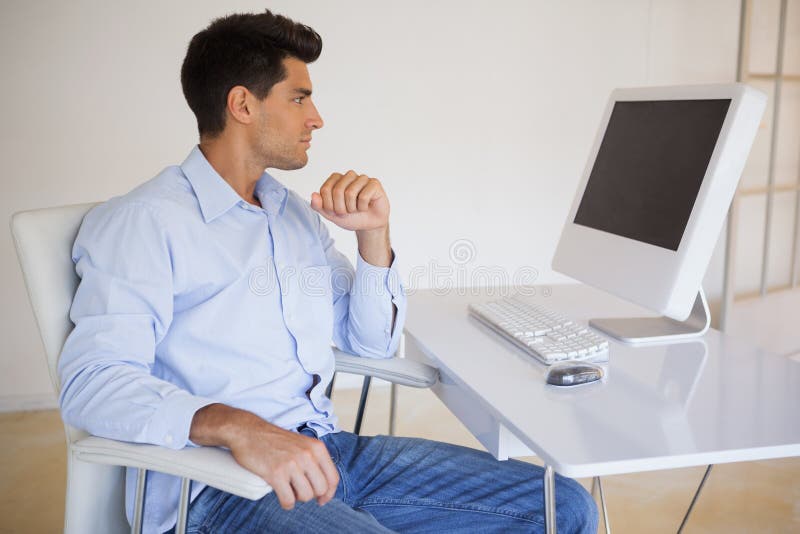 Casual Businessman Looking at Computer Screen Stock Photo - Image of ...