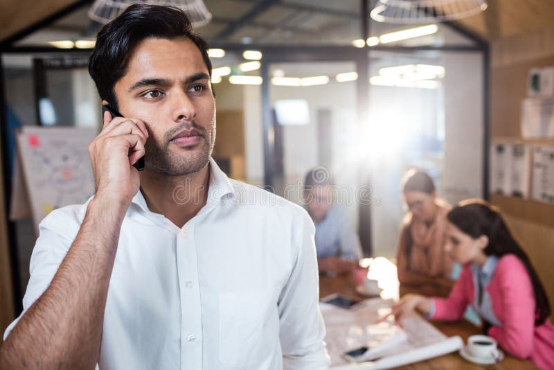Casual Businessman Making a Phone Call Stock Photo - Image of graphic ...