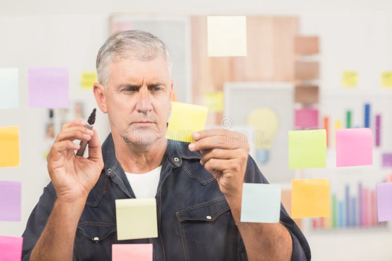 Casual Businessman Writing on Post Its Stock Photo - Image of designer ...