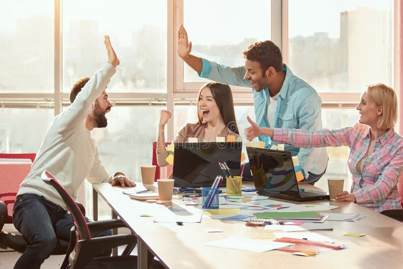 Casual Colleagues Doing High-five in the Office. Stock Image - Image of ...