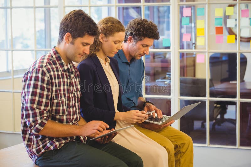 Casual Colleagues Using Technology Stock Photo - Image of designer ...