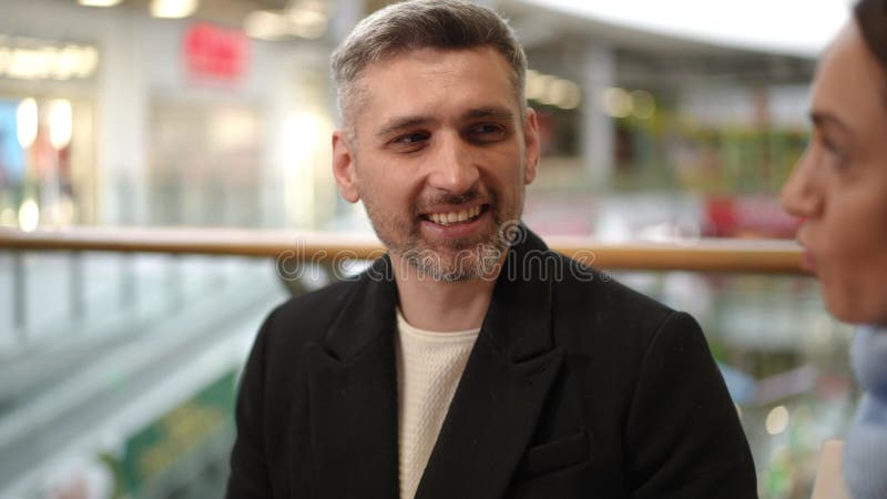 A Casual Conversation Taking Place between Two Professionals in a ...