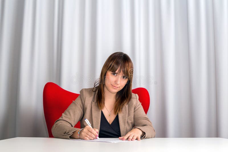 Casual Elegant Businesswoman at Office Writing Document Stock Photo ...