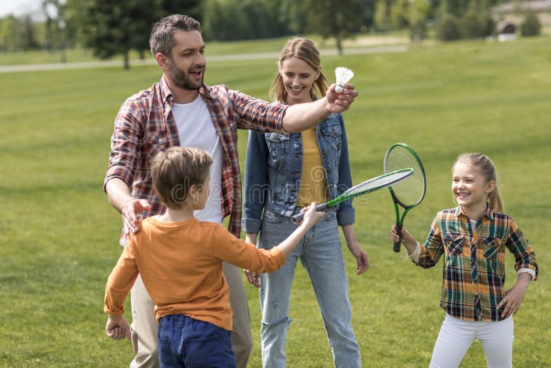 Casual Family Playing Badminton in Park at Daytime Stock Image - Image ...