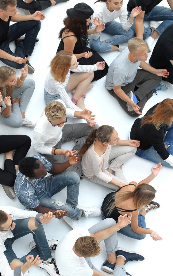 Casual Group of Young People Meditating Sitting on the Floor. Stock ...
