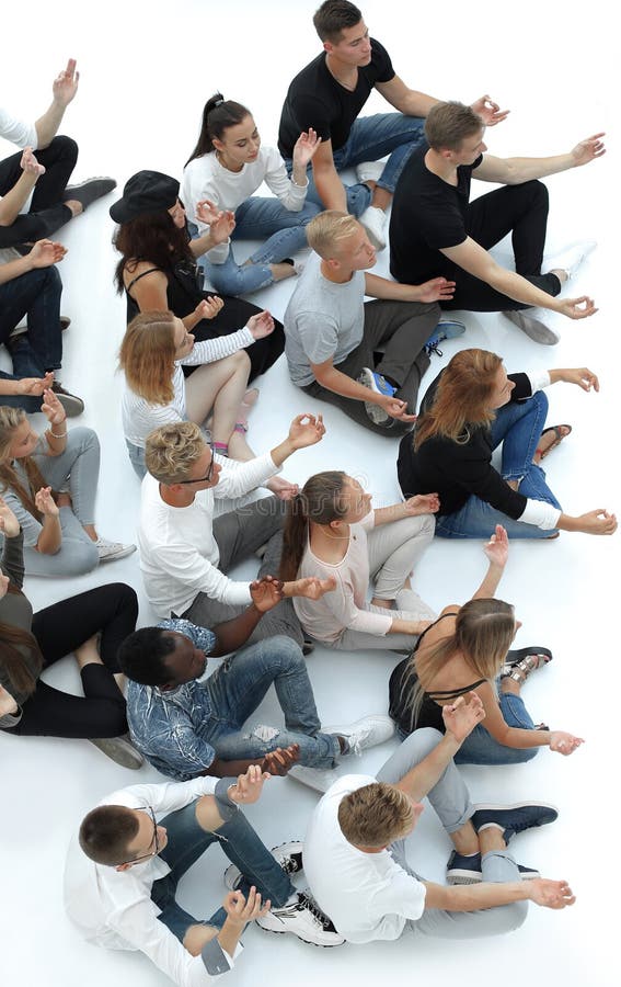Casual Group of Young People Meditating Sitting on the Floor. Stock ...