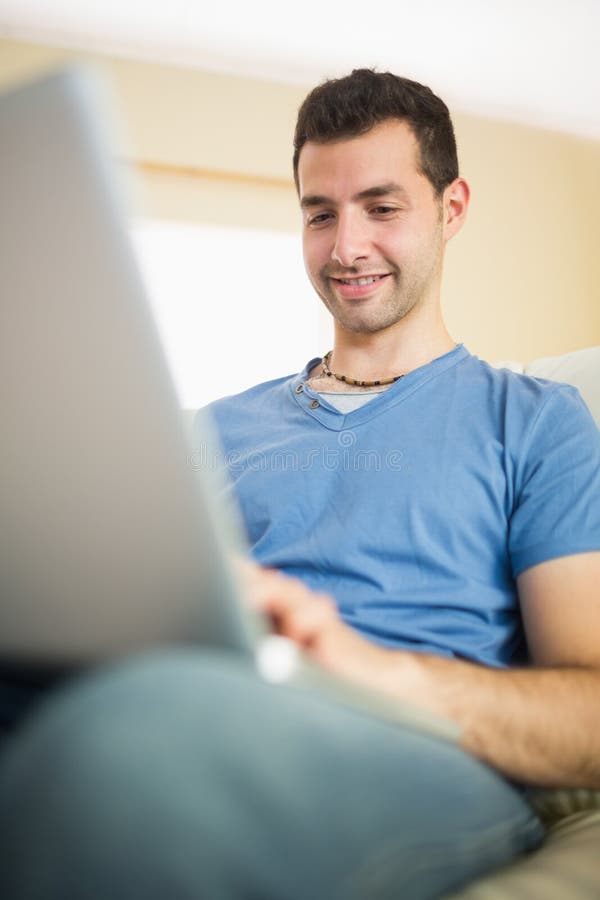 Casual Handsome Man Sitting on Couch Using Looking at Laptop Stock ...