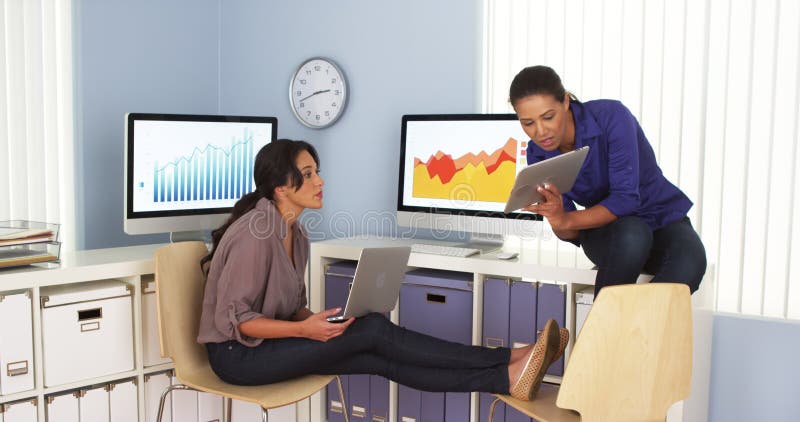Close Up of Smiling Hispanic Business Woman in Office Looking at Camera ... Close Up of Smiling Hispanic Business Woman in Office Looking at Camera ...
