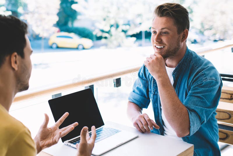 Casual Male Chatting with Friend in Cafeteria Stock Image - Image of ...