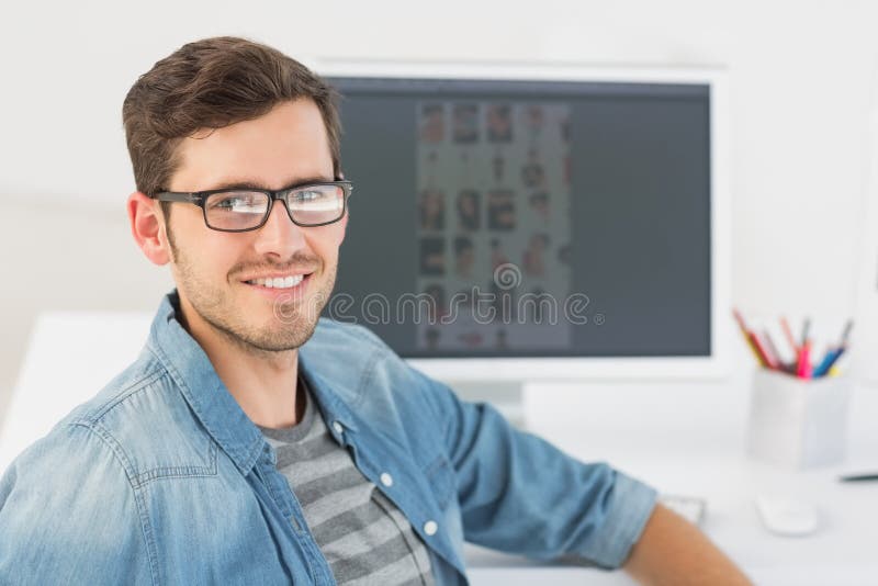 Male Photo Editor Working on Computer in a Bright Office Stock Image ...