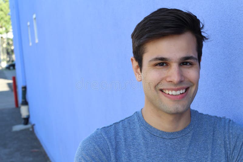Casual Male Student at College Looking Happy with Copy Space Stock ...