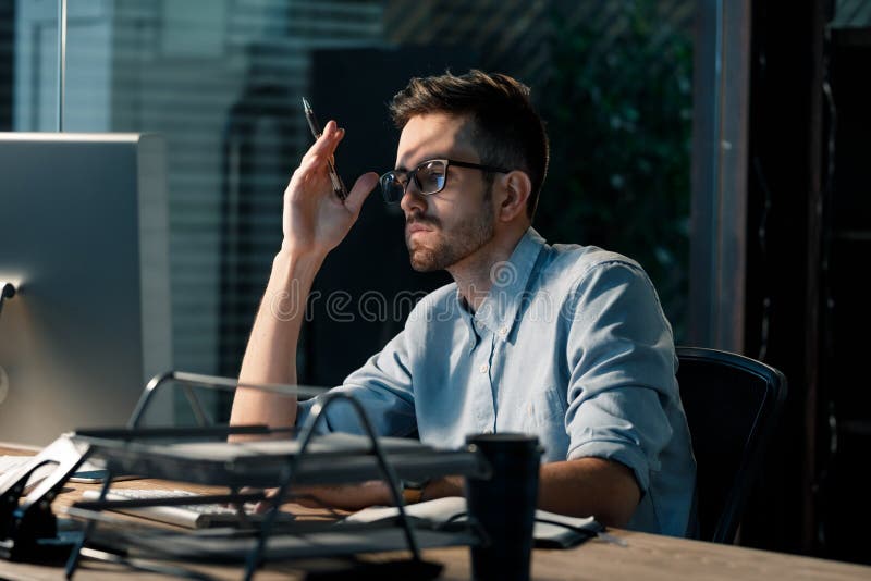 Exhausted Young Man in Office Working Late Stock Photo - Image of ...