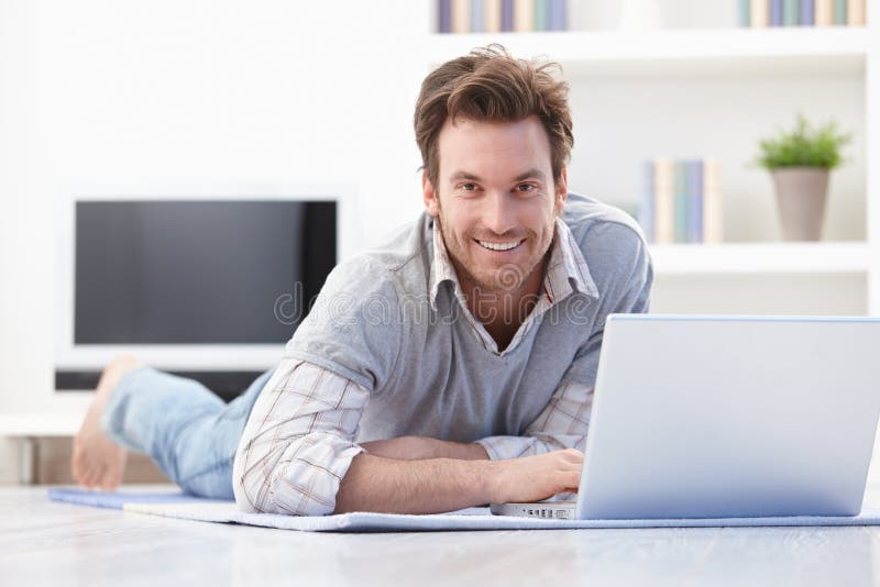Casual Man Laying on Floor at Home Smiling Stock Image - Image of alone ...
