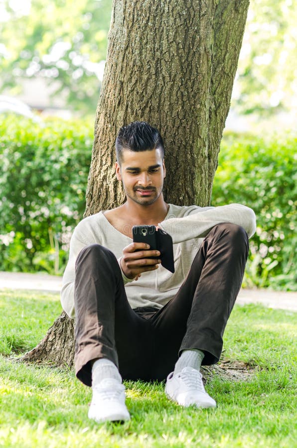 Casual Man Outdoors on a Field Stock Image - Image of body, attractive ...