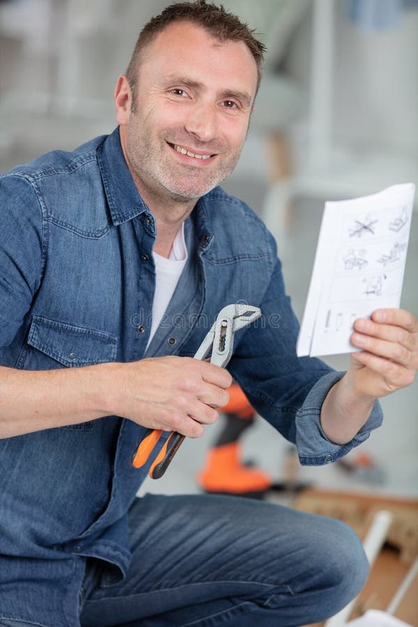 Casual Man Reading Instruction Manual Stock Image - Image of ...