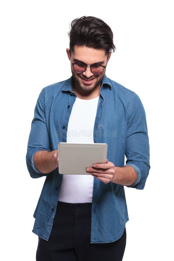 Casual Man Reading Something on a Computer Tablet. Stock Photo - Image ...