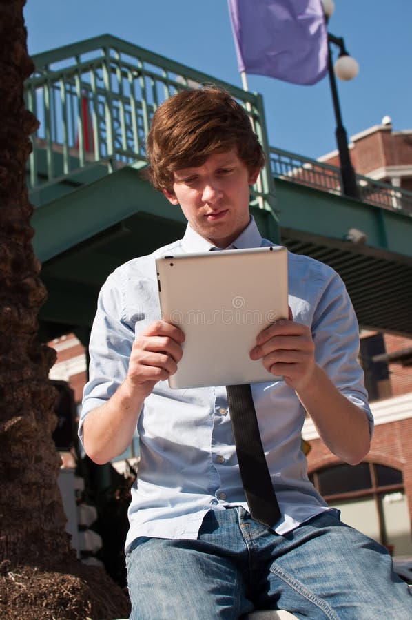 Casual Man Sitting Outside with Smart Tablet Stock Image - Image of ...