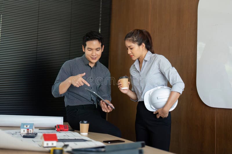 Casual Meeting Over Project Plans. Engineers Enjoy Coffee while ...