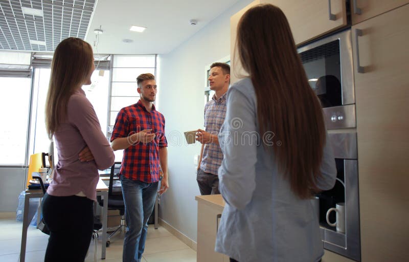 Casual Office People Talking by the Coffee Maker. Stock Image - Image ...