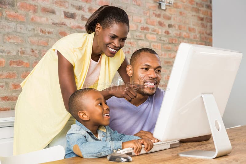 Casual Smiling Family on a Computer Stock Photo - Image of household ...