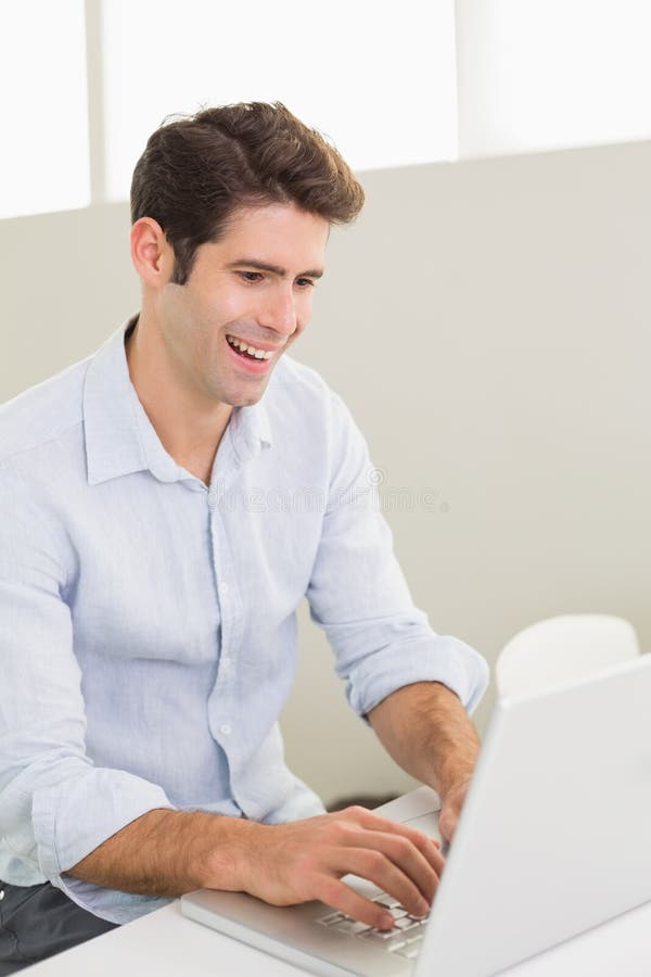 Casual Smiling Man Using Laptop at Home Stock Image - Image of ...