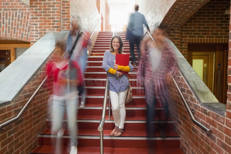 Casual Smiling Student Standing on Stairs Stock Photo - Image of ...