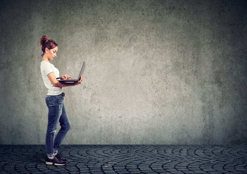 Casual Student Standing Using Laptop Computer Stock Photo - Image of ...