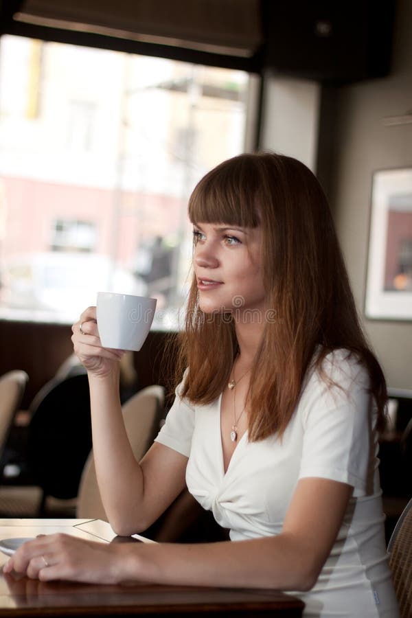 Casual Woman Sipping Coffee in Cafe Stock Photo - Image of beautiful ...