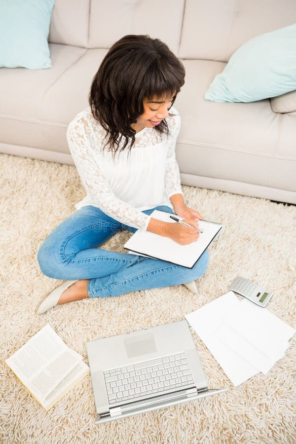 Casual Woman Writing Notes while Using Laptop Stock Image - Image of ...