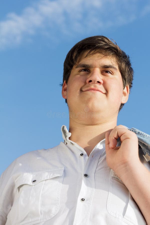 Casual Young Man with a Jacket Over His Shoulder Stock Photo - Image of ...