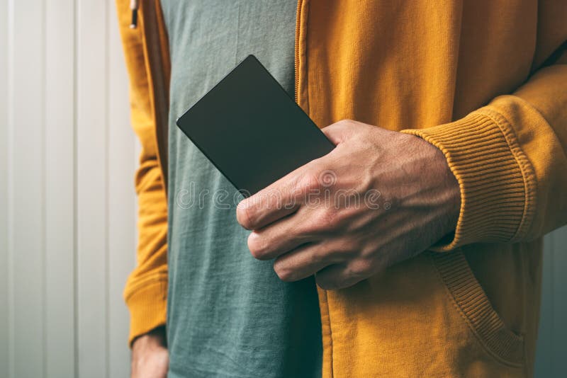 Casual Young Man Posing with Mobile Phone in Hand Stock Image - Image ...