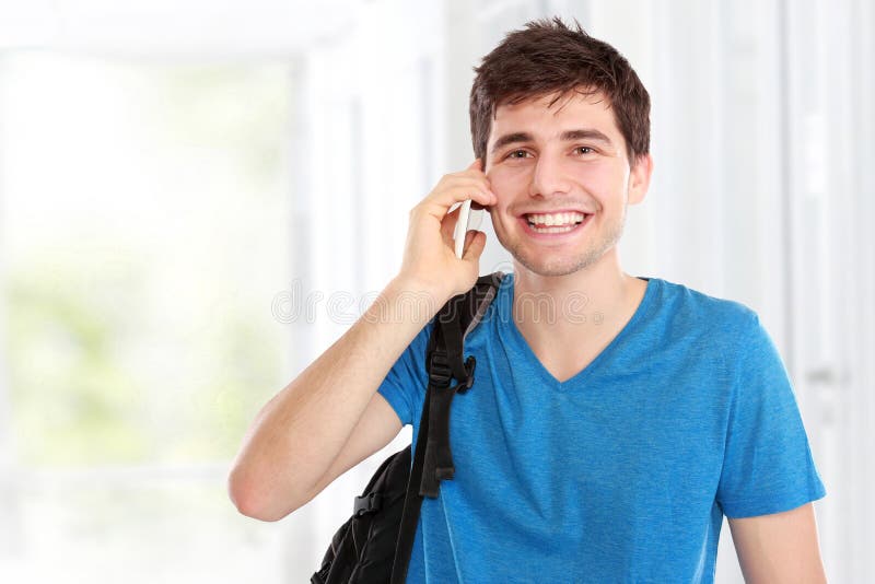 Casual Young Man Speaking on the Phone Stock Photo - Image of college ...