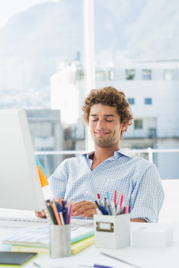 Casual Young Man Using Computer in Bright Office Stock Image - Image of ...