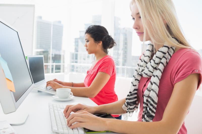 Casual Young Women Using Computers in Office Stock Photo - Image of ...