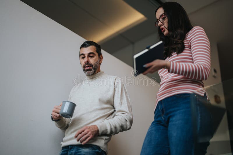 Professional Man Having a Discussion with a Female Colleague in Office ...