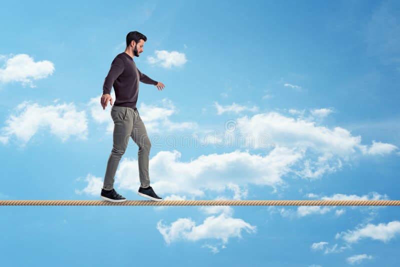 Man Walks On A Tightrope Over A Cliff Stock Image - Image of rope ...