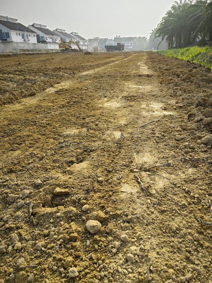 CAT Digger Moving Soil into Back of Large Truck at the New Developing ...