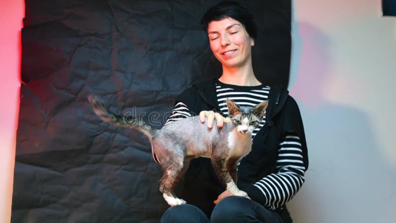 The Cat Sits on the Lap of a Transgender Girl. Stock Video - Video of ...