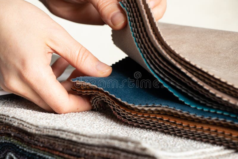 A Catalog of Different Colors of Fabrics in the Hands of a Girl for the ...