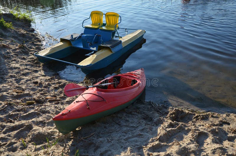 Catamaran and Boat for Rafting on the Lake Shore Stock Photo - Image of ...