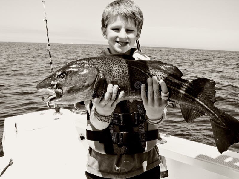 Boy catches fish stock image. Image of ocean, catch - 113595663