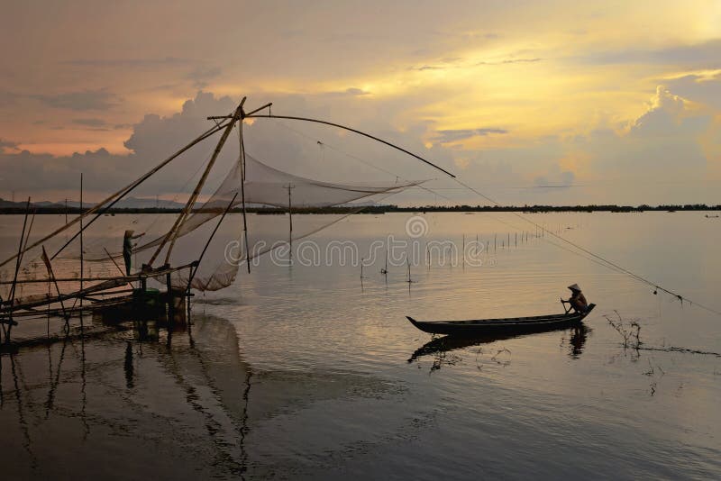 Catch fish during sunset. stock image. Image of landscape - 179341527