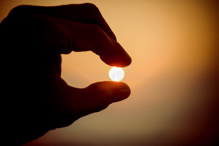 Catch the Sun stock photo. Image of catching, hand, finger - 44606714
