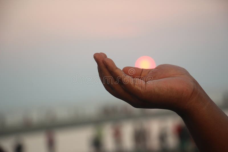 Catch sun in hand. Sunset stock photo. Image of catch - 241806668