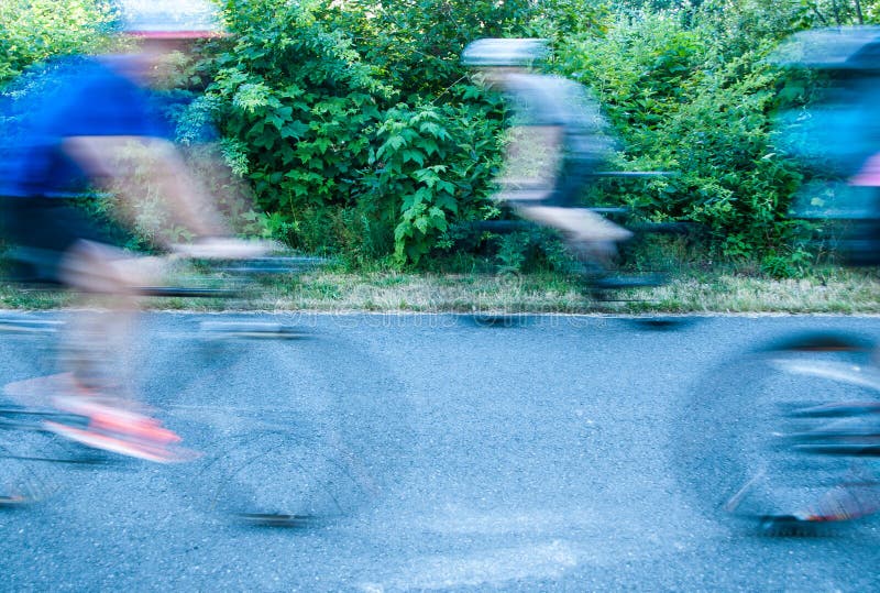 Multiple Bicyclists Blurred To Show Motion Stock Image - Image of ...