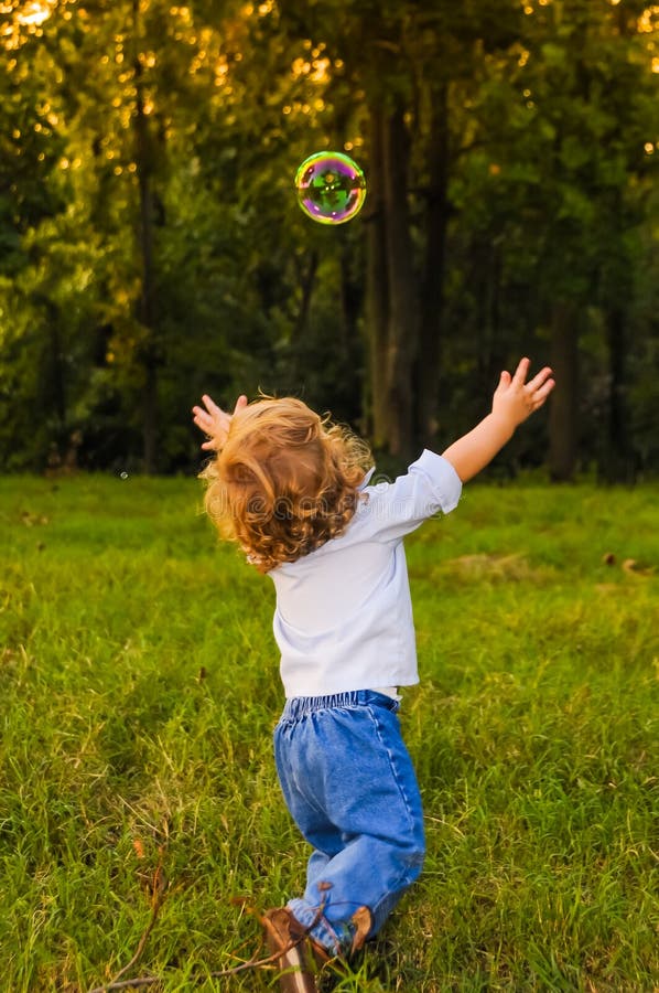 Catching Bubbles stock photo. Image of expression, baby - 103234552
