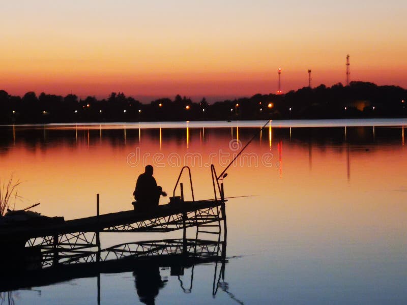 Catching Fish during Sunset Stock Image - Image of fish, fishing: 251477405